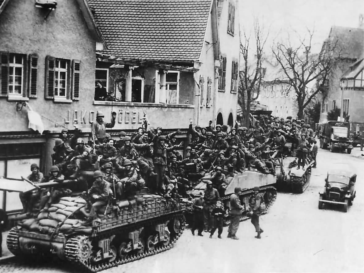 US 7th Army Troops and M4 Sherman Tanks Move thru Captured German Town ... US 7th Army Troops and M4 Sherman Tanks Move thru Captured German Town ...